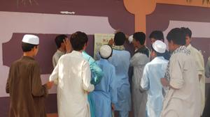 Afghan youths go house-to-house raising HIV awareness | UNAMA
